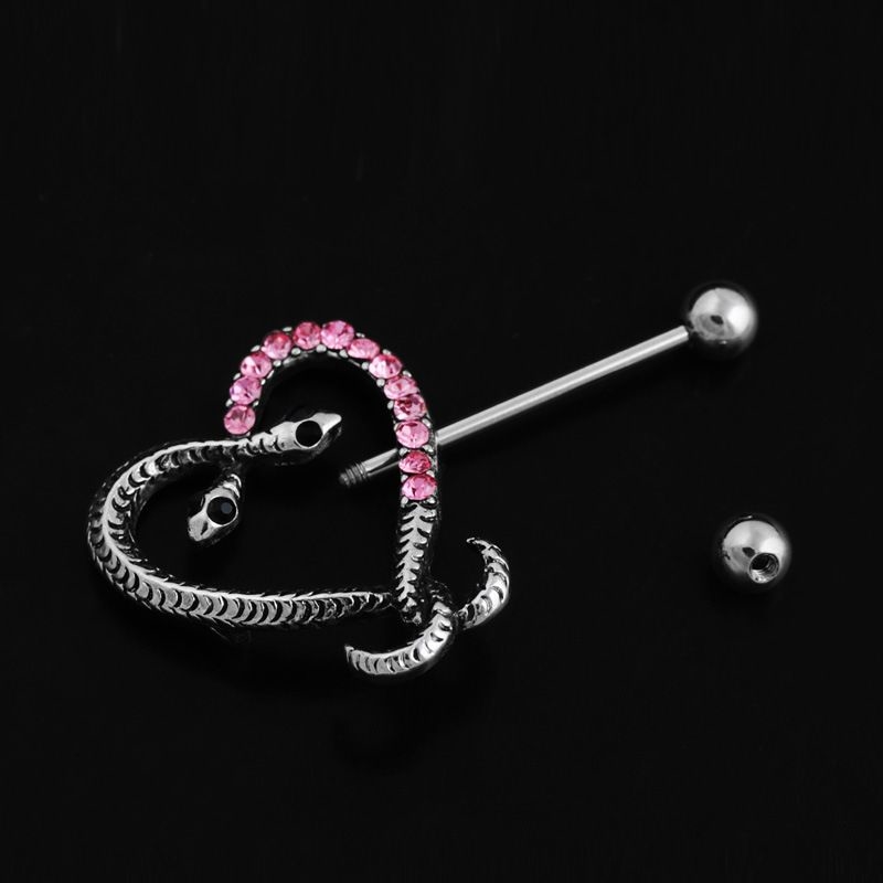 Piercings pezones corazón serpientes